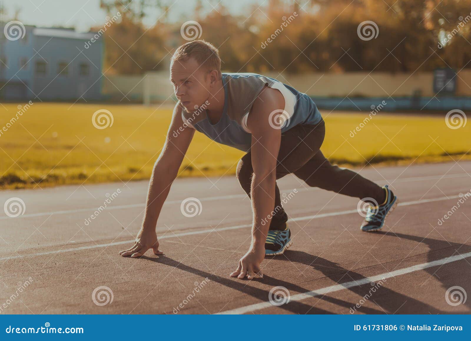 Athletic Man Standing in Posture Ready To Run on a Treadmill. Stock ...