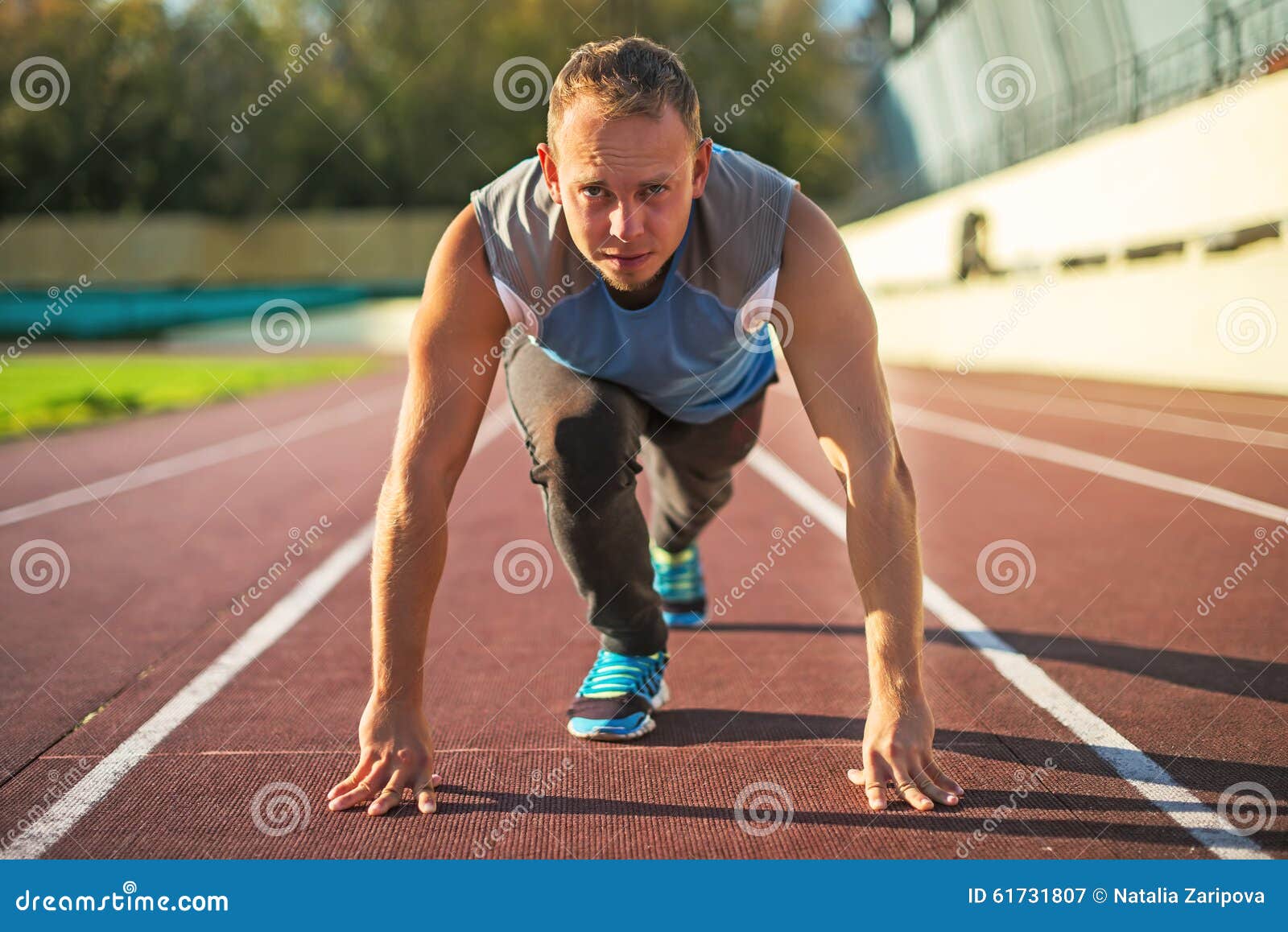 Athletic Man Standing in Posture Ready To Run on a Treadmill. Stock ...