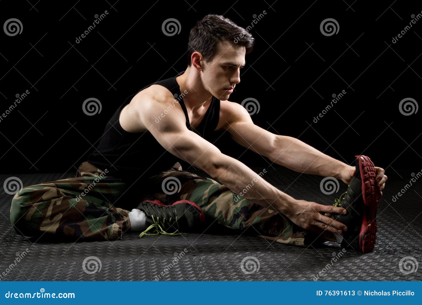 Athletic Man Stretching stock image. Image of pants, muscular - 76391613