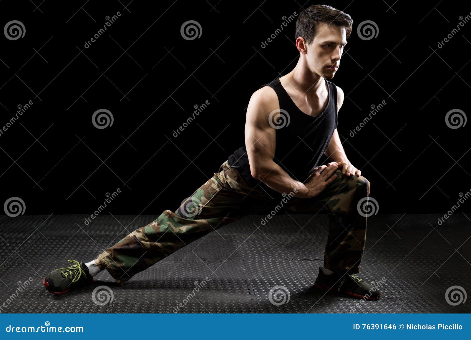 Athletic Man Stretching stock photo. Image of exercise - 76391646