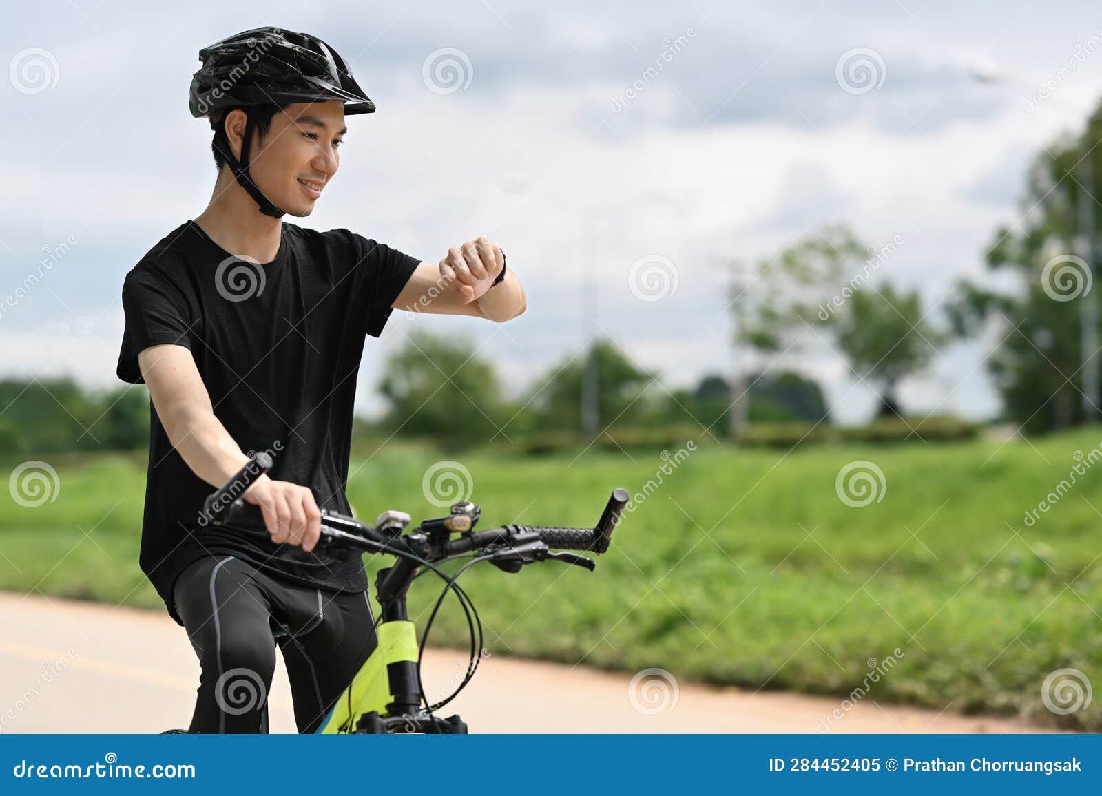 Athletic Man and Taking a Break during Cycling in Park and Checking ...