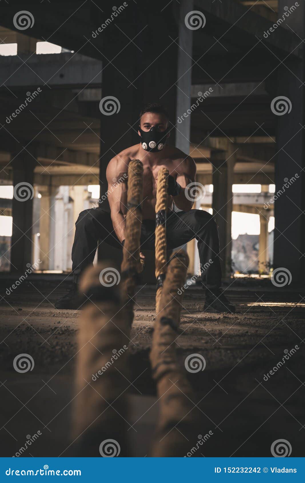 Athletic Man Training with Battle Ropes Stock Photo - Image of ...