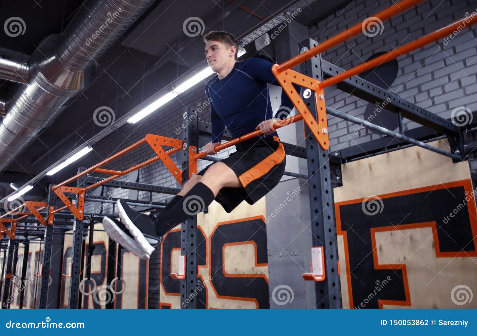 Athletic Man Training in Modern Gym Stock Photo - Image of athletic ...
