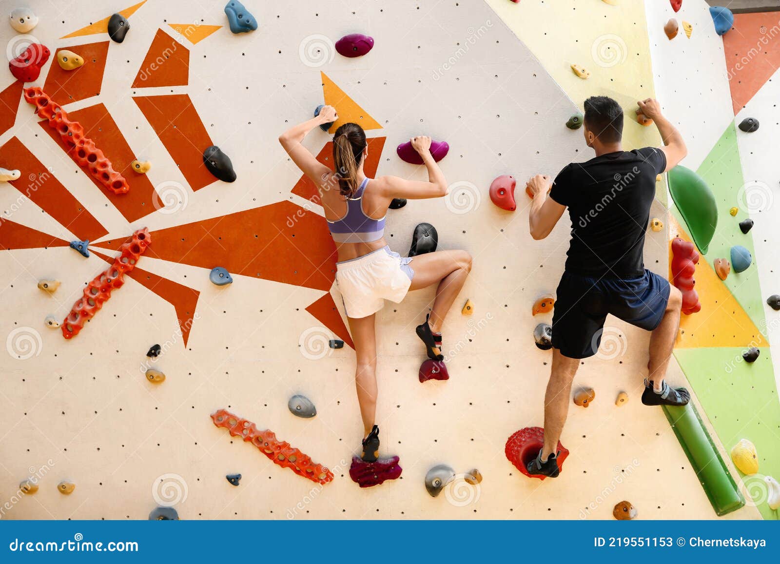 Athletic Man and Woman Climbing Wall in Gym, Back View Stock Image ...