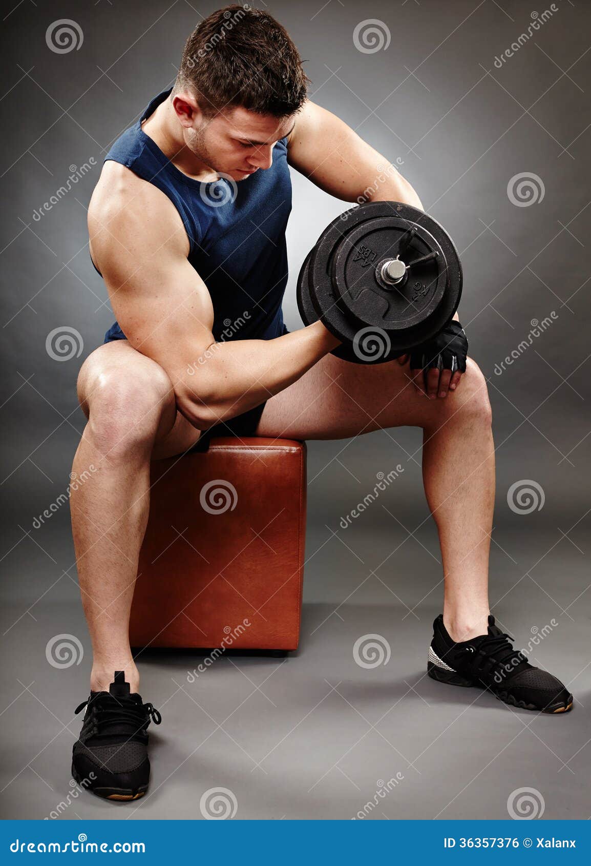Athletic Man Working with Heavy Dumbbells Stock Photo - Image of ...