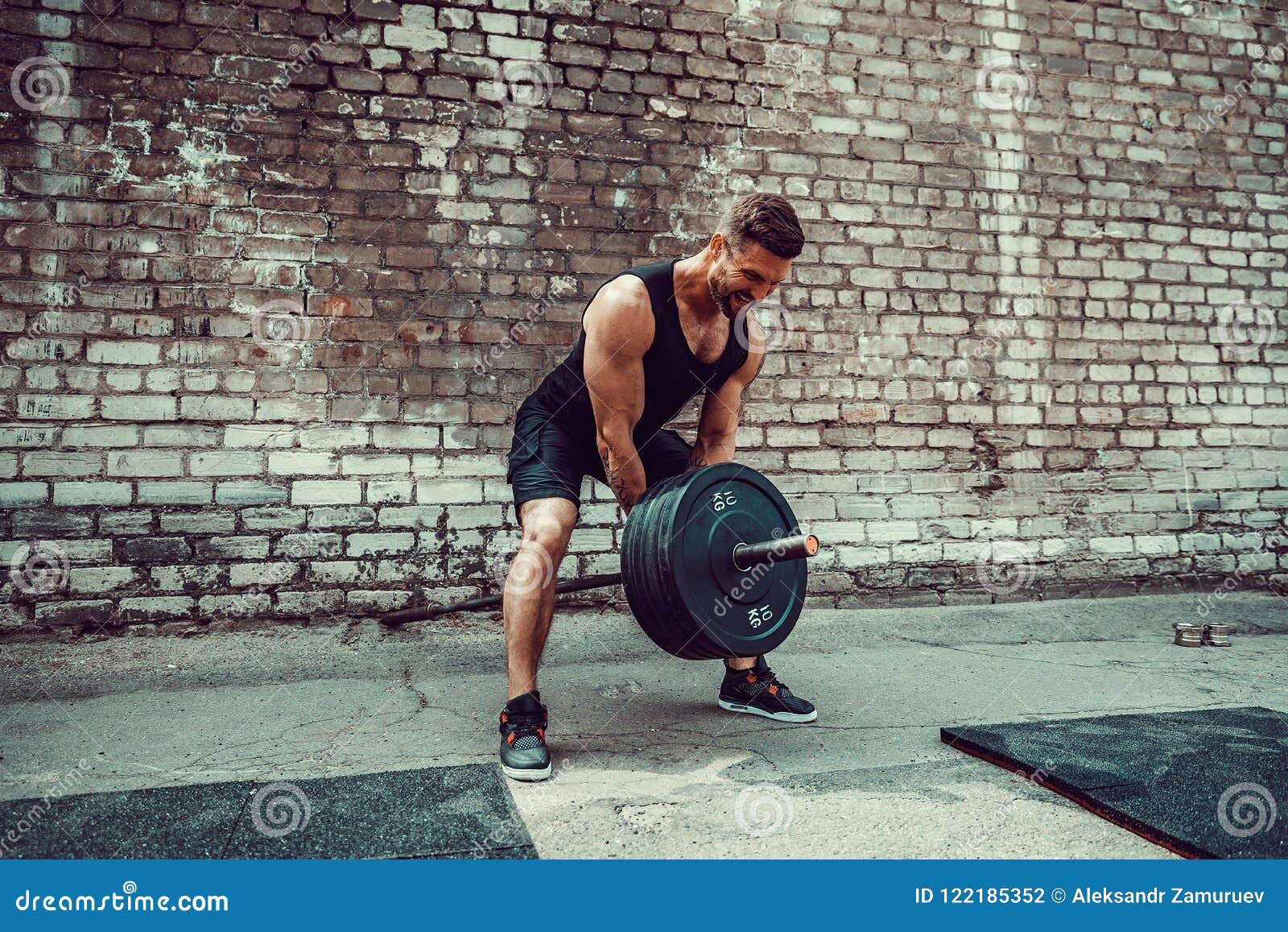 Athletic Man Working Out with a Barbell. Strength and Motivation ...