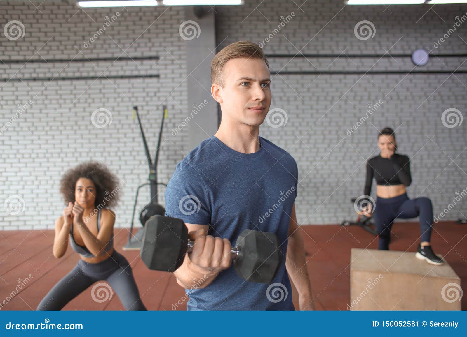 Athletic Man Doing Exercise with Dumbbell in Modern Gym Stock Image ...