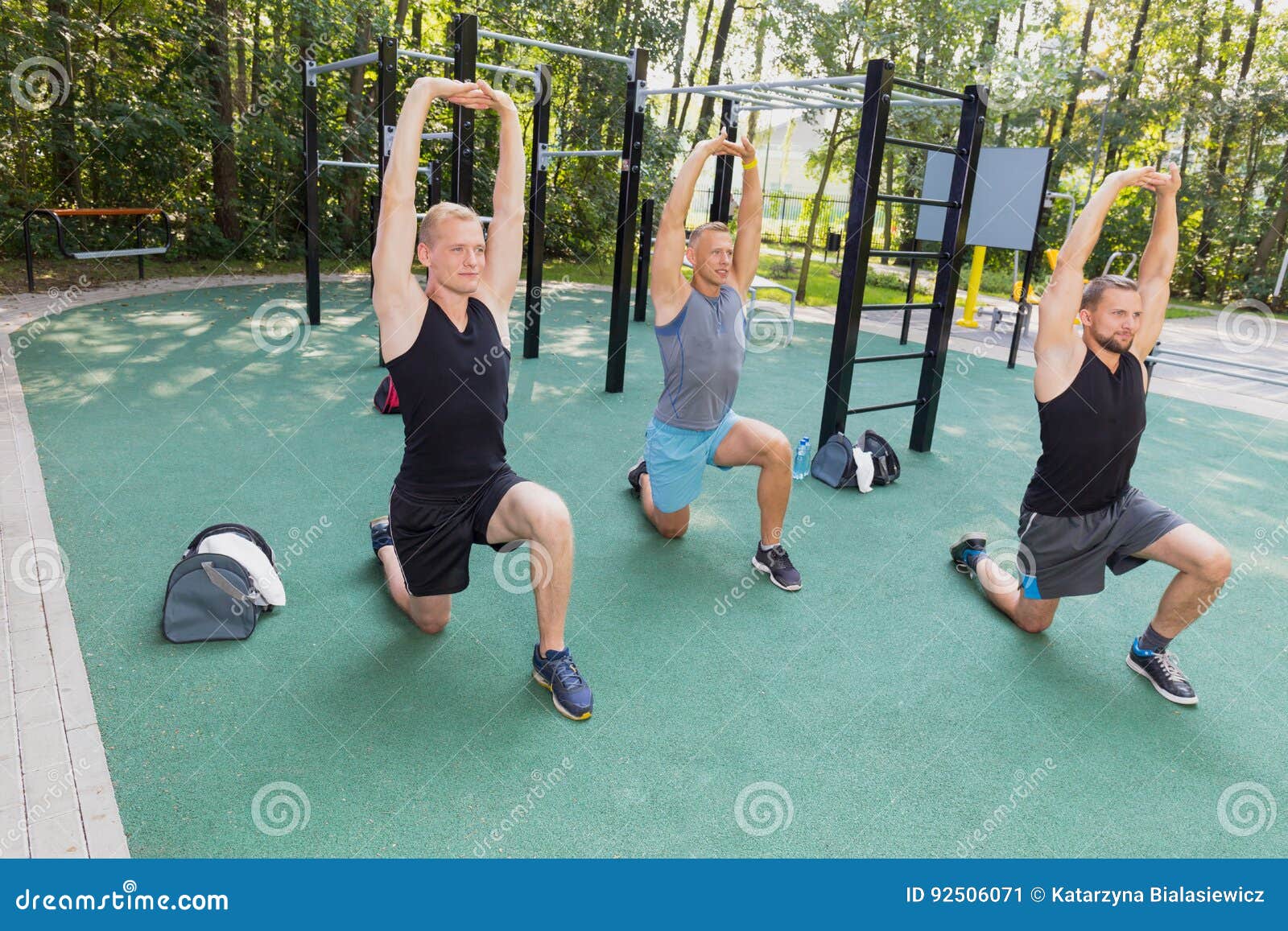 Athletic men stretching stock image. Image of exercise - 92506071