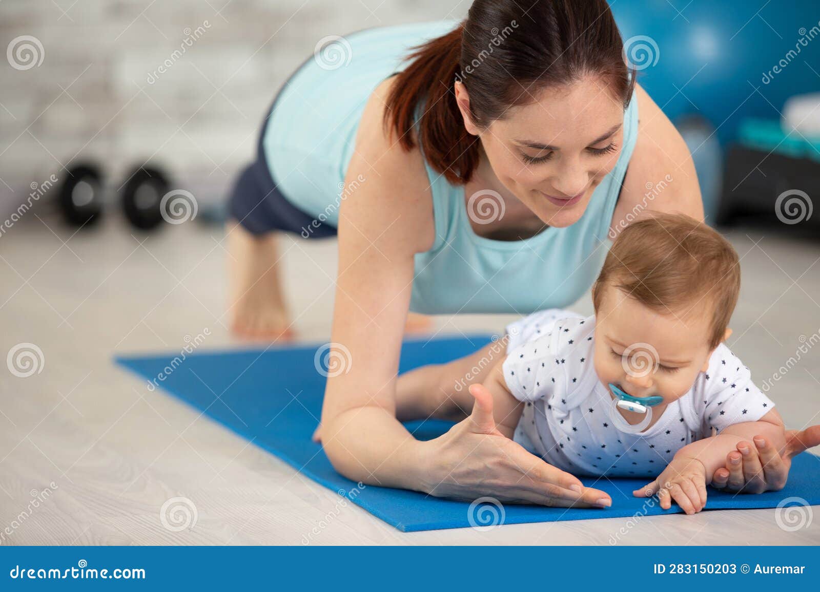 Athletic Mother Exercising in Plank Position with Baby Stock Image ...
