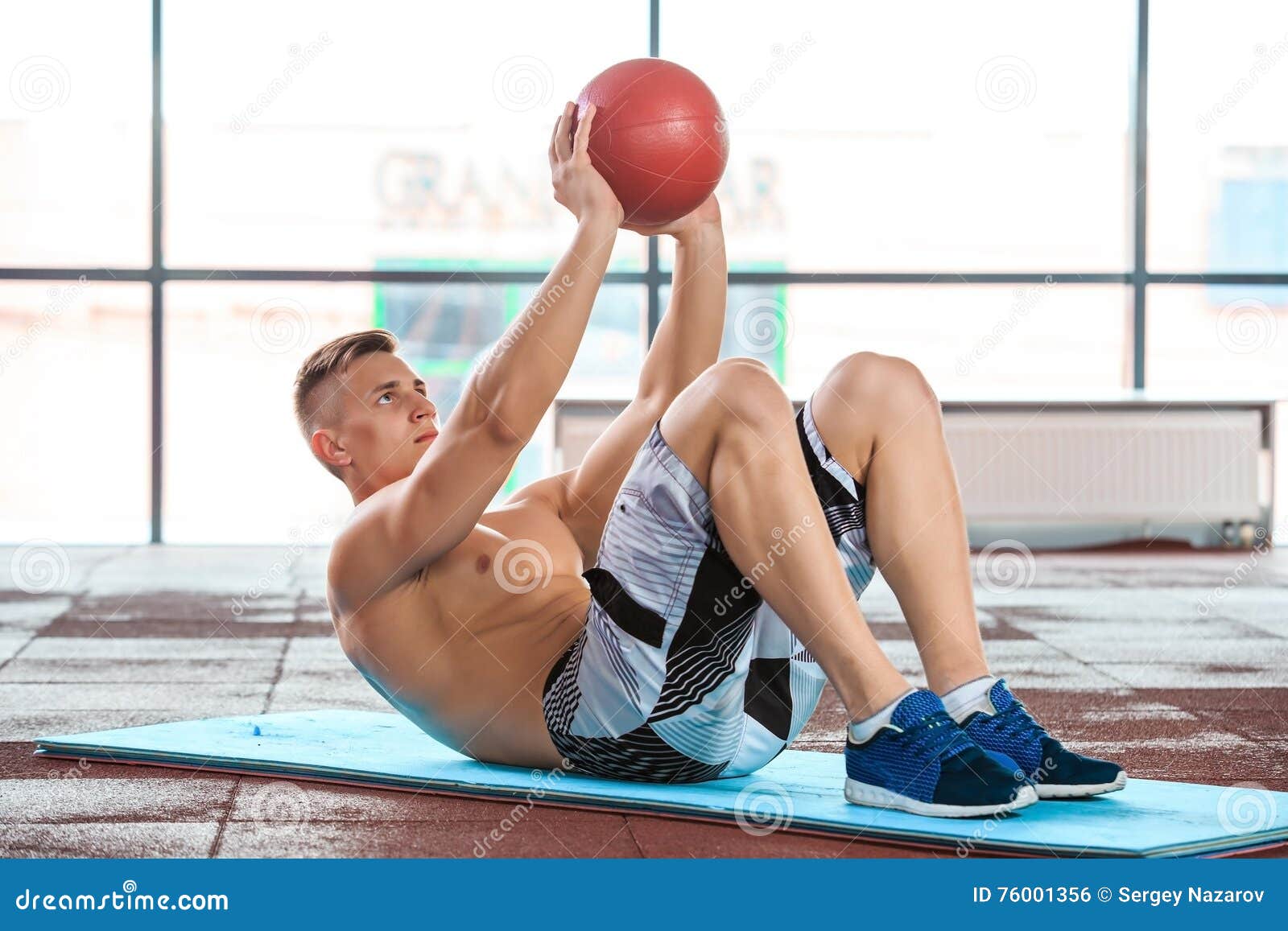 Athletic Muscular Guy Doing Exercise Stock Photo - Image of focused ...