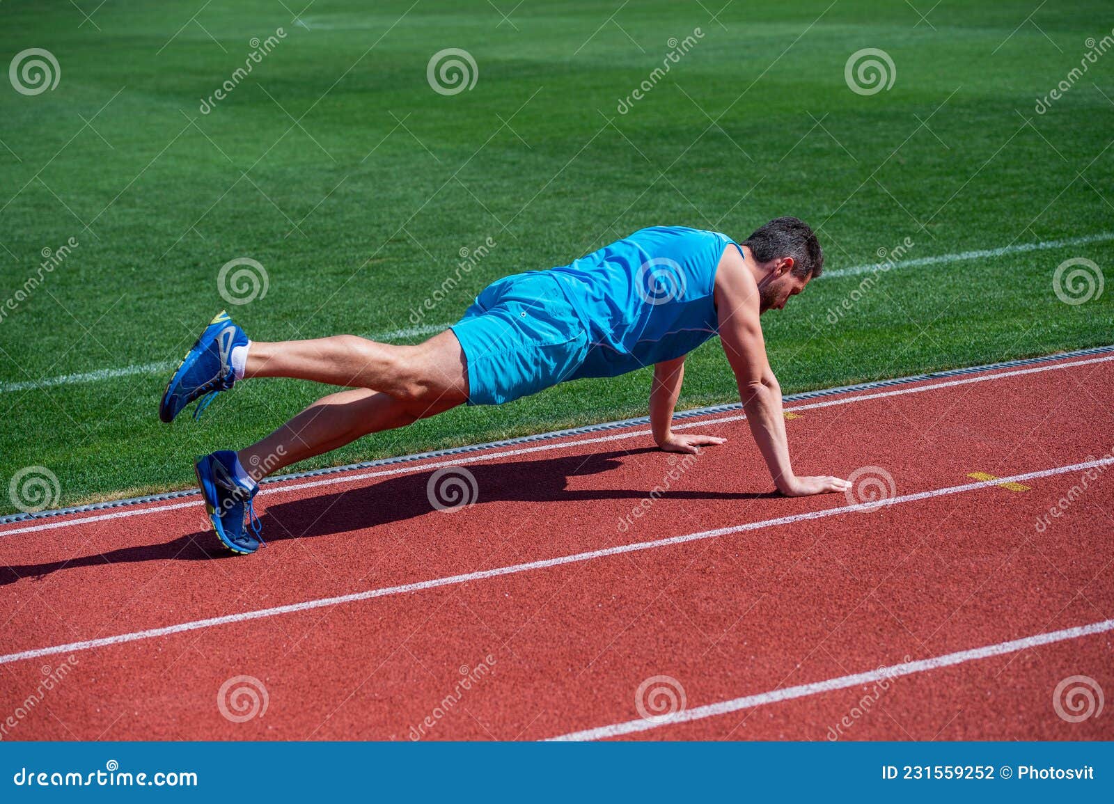 Athletic Muscular Man Doing Plank Outdoor on Stadium, Core Stock Photo ...