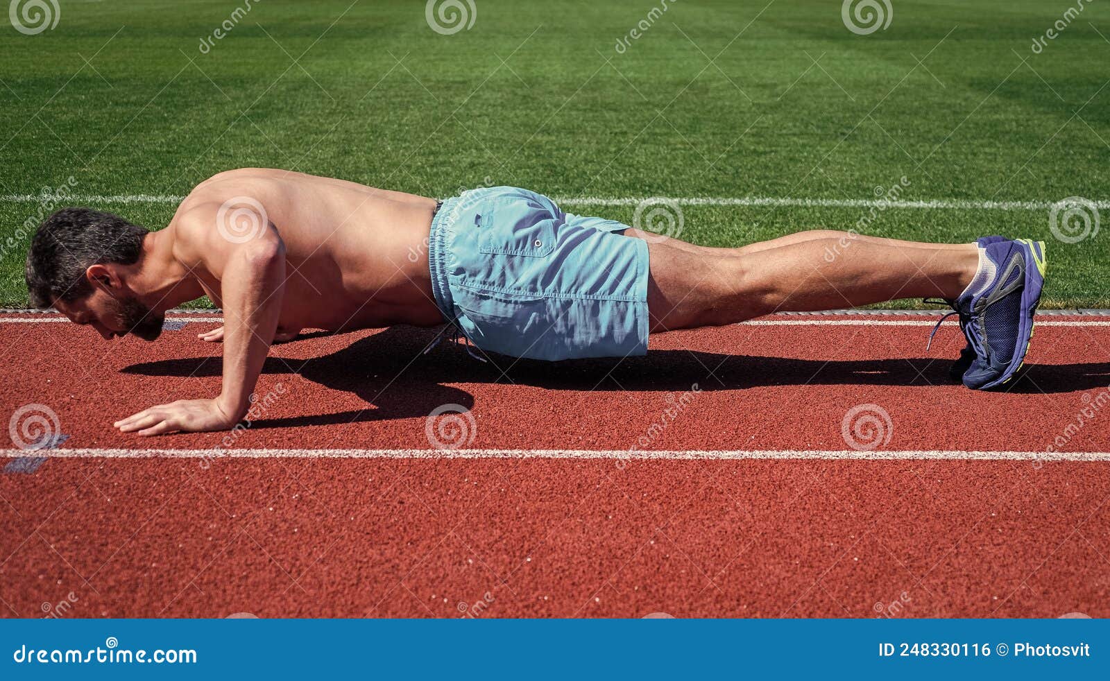 Athletic Muscular Man Doing Plank Outdoor on Stadium, Core Stock Photo ...