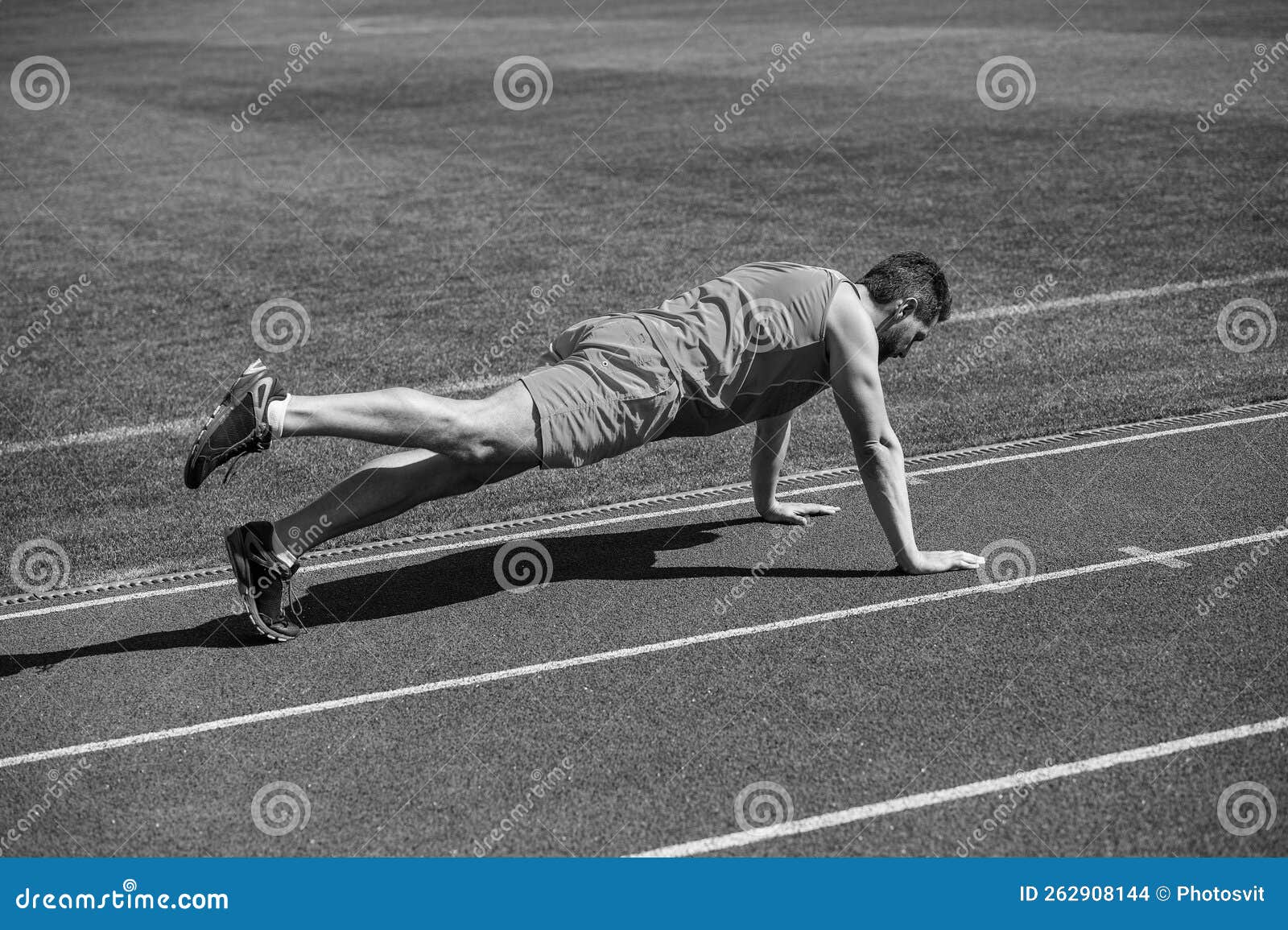 Athletic Muscular Man Doing Plank Outdoor on Stadium, Core Stock Photo ...