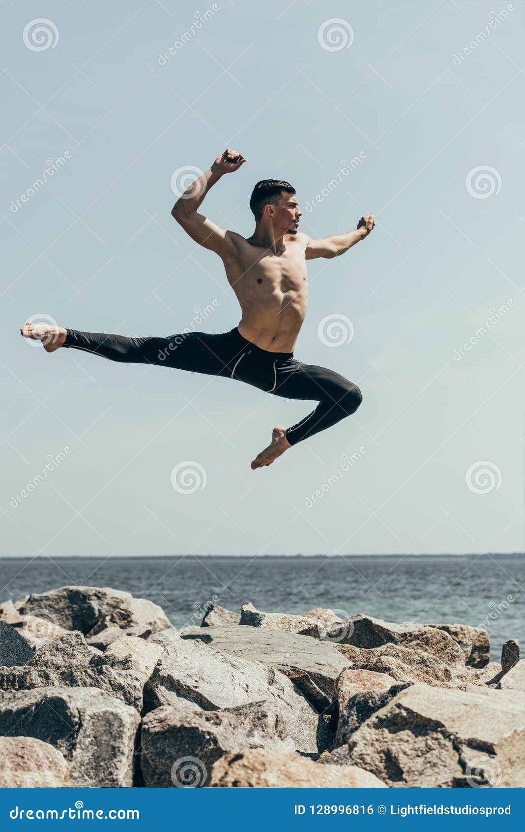 Athletic Shirtless Dancer Jumping Over Stock Photo - Image of stones ...