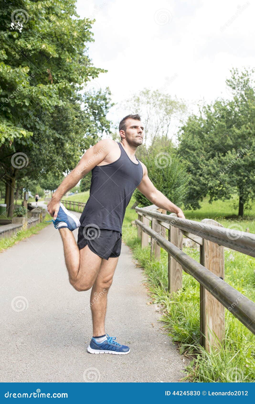 Athletic Strong Man Doing Stretches before Exercising, Outdoor. Stock ...