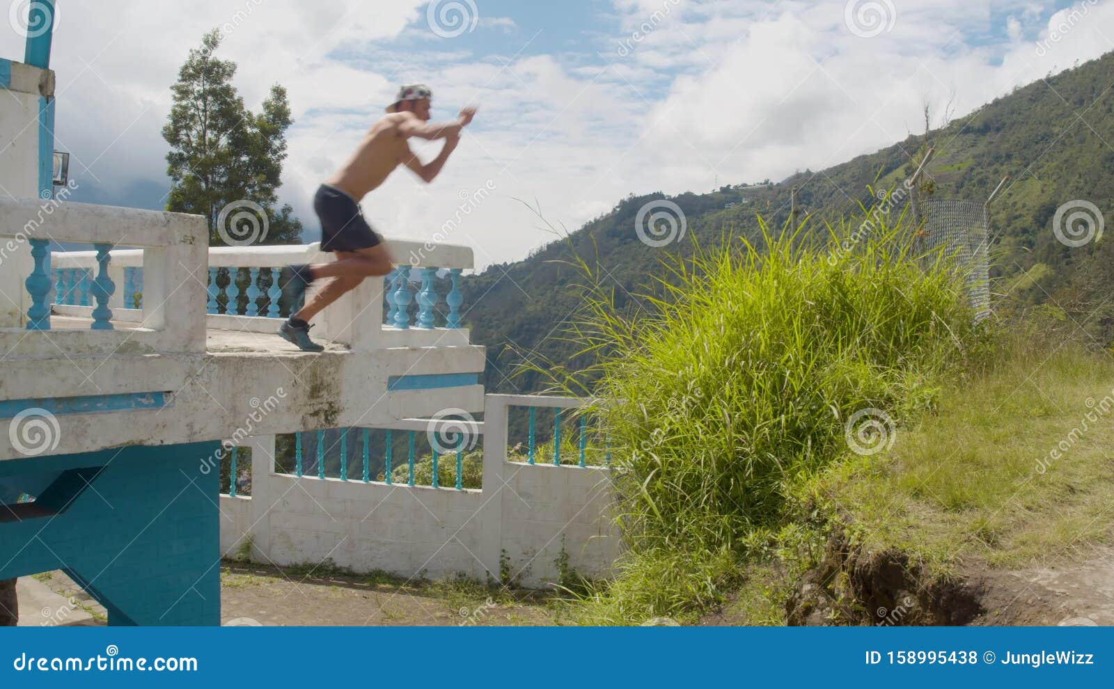 Athletic Tourist Making a Big Jump from a Forbidden Monument Stock ...