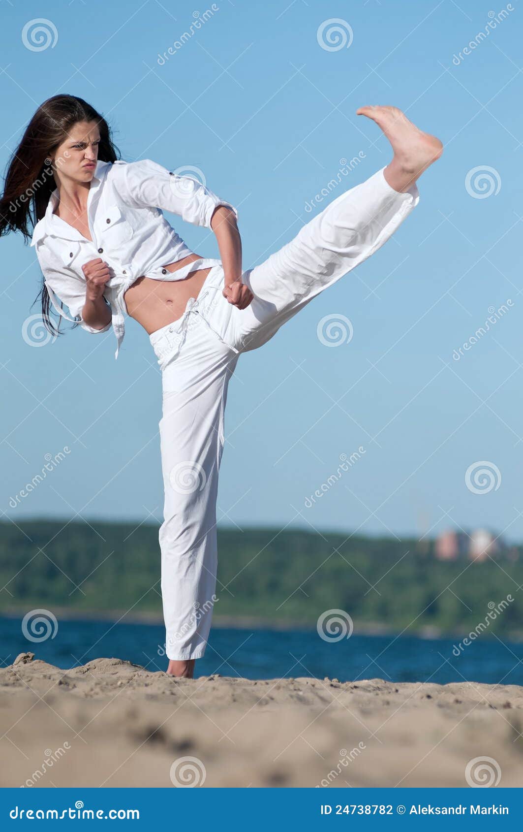 Athletic Woman Performing a Kick Stock Photo - Image of karate, kick ...