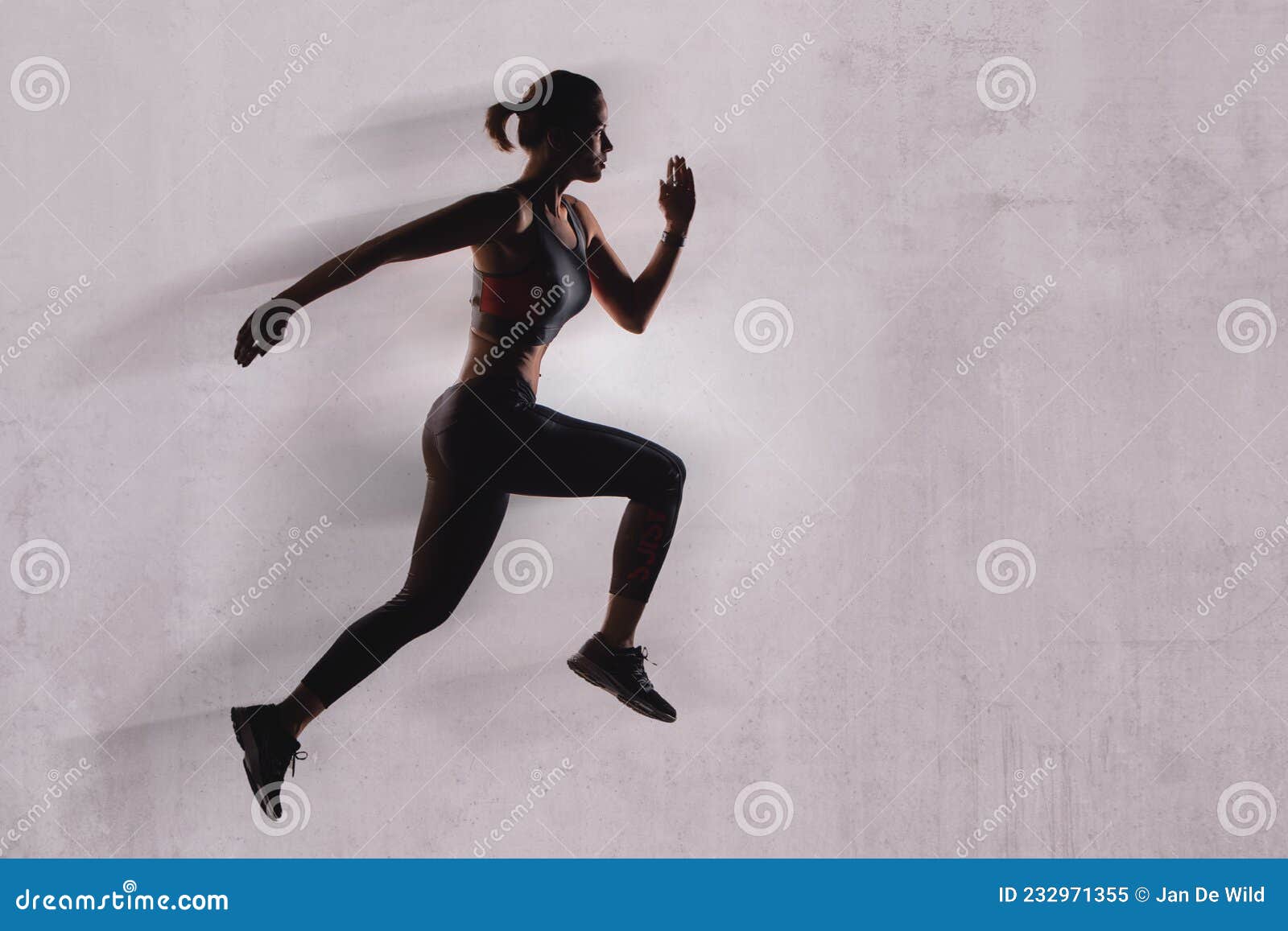 Athletic Woman Running Forward in the Studio Stock Image - Image of ...