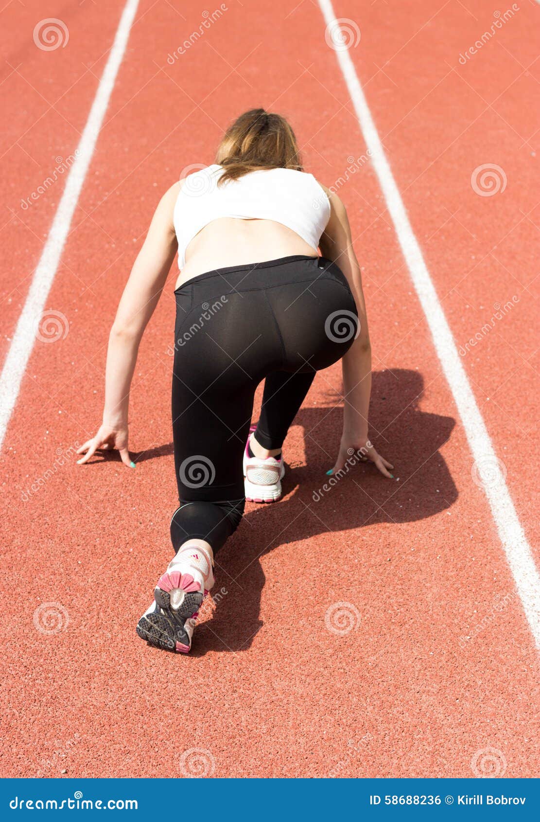 Athletic woman on track stock photo. Image of compete - 58688236