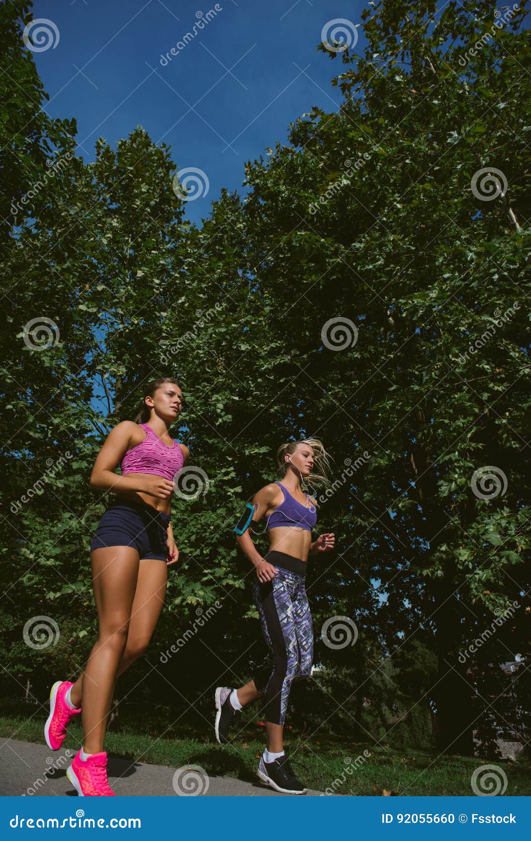 Athletic Women Exercising by Jogging in Nature Stock Photo - Image of ...