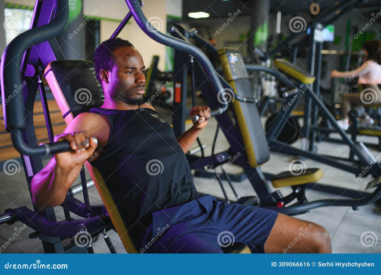 Athletic Young Black Man Having Workout on Chest Press Machine in Gym ...