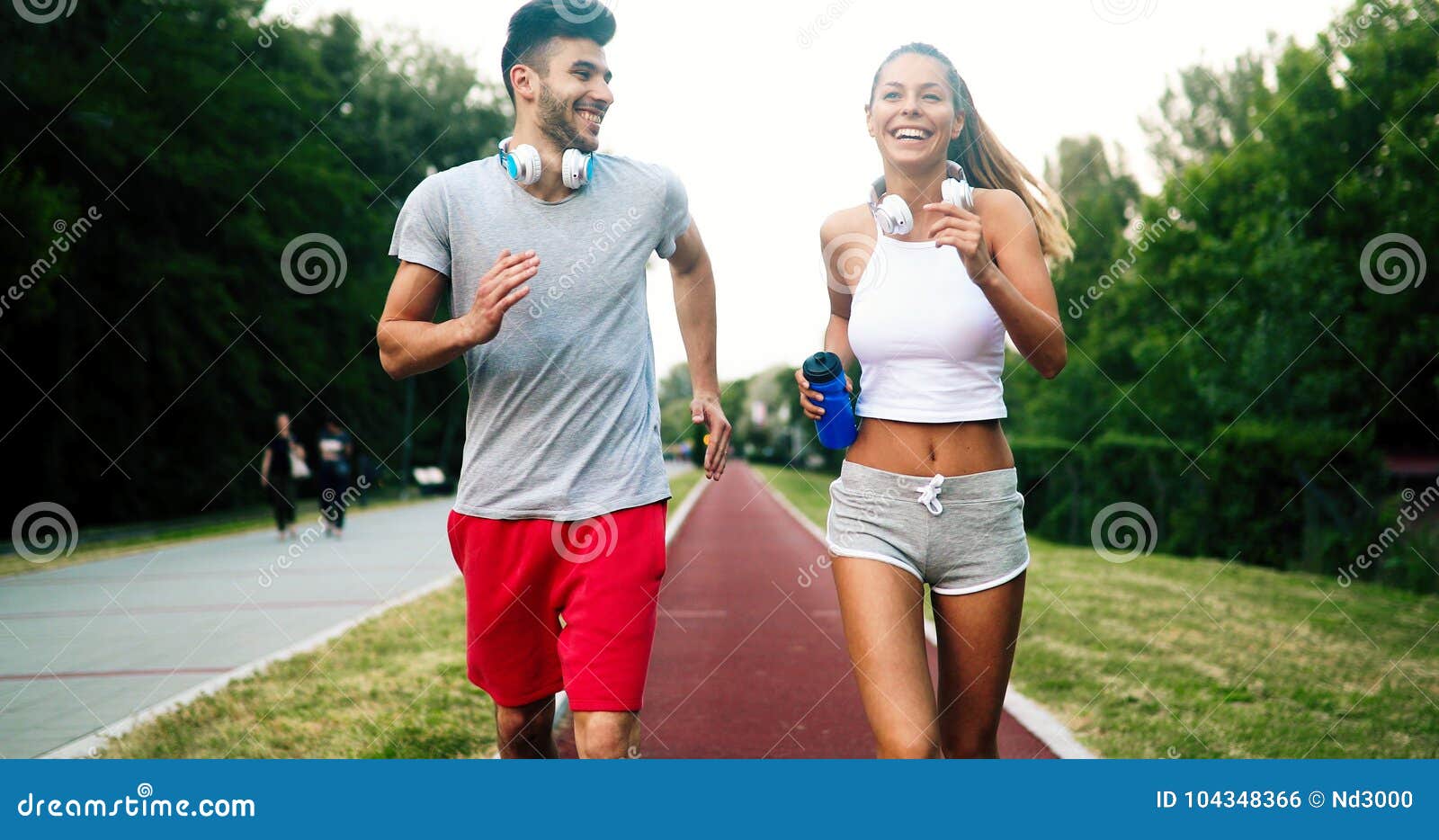 Athletic Couple Jogging Together Stock Photo - Image of group, partner ...