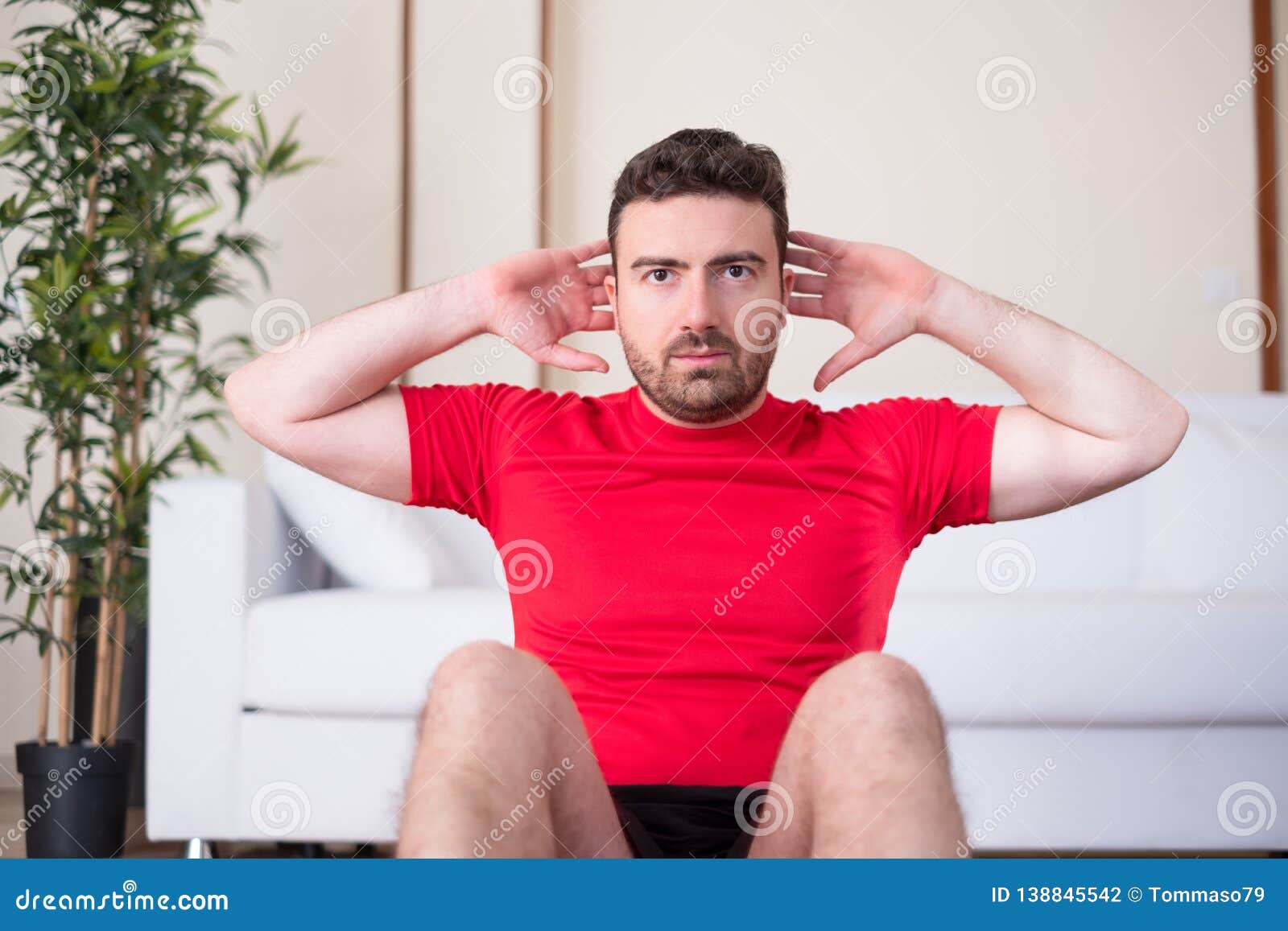 Athletic Young Man Doing Curl Ups Exercise at Home Stock Photo - Image ...