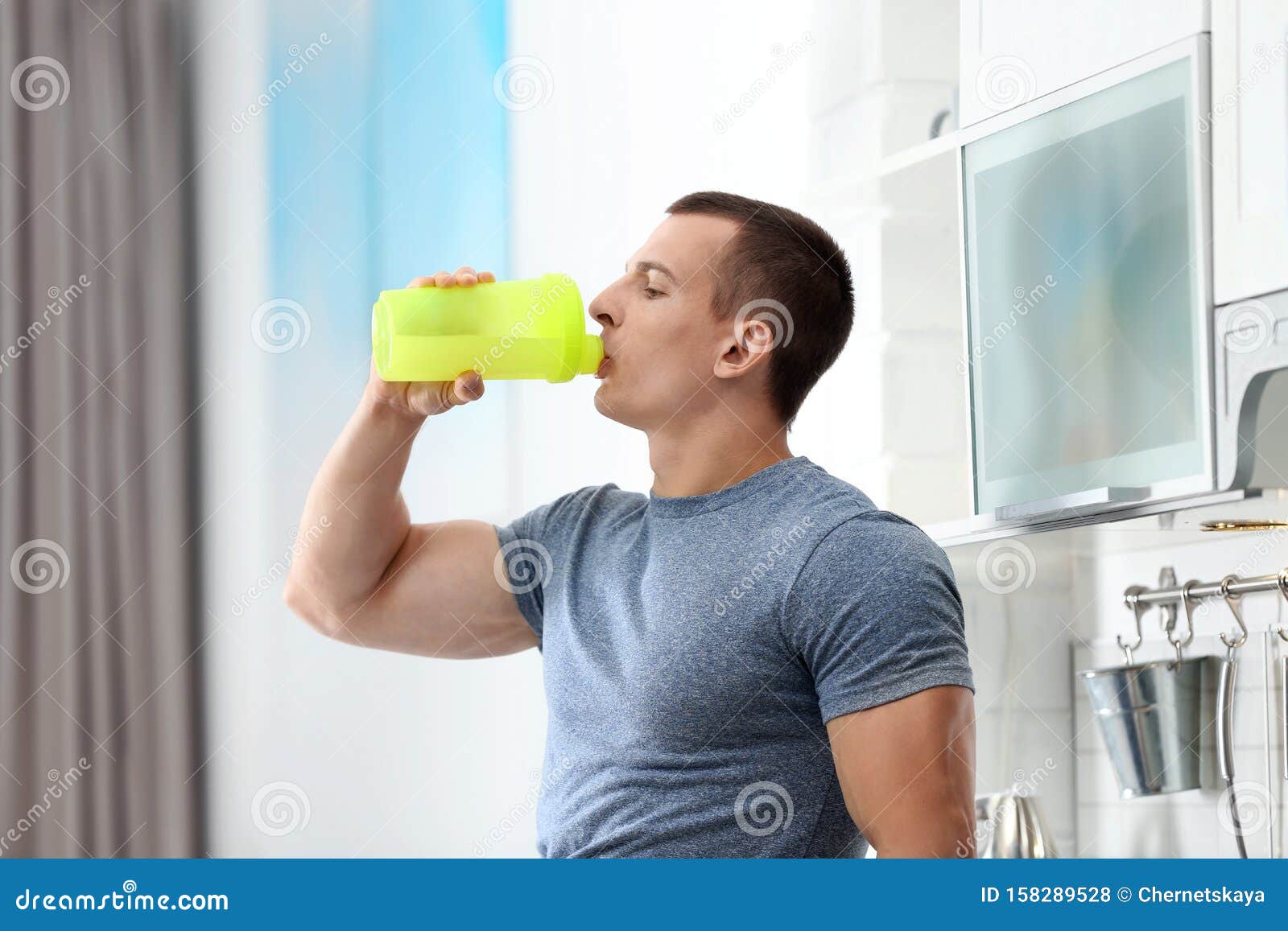 Athletic Young Man Drinking Shake in Kitchen Stock Photo - Image of ...
