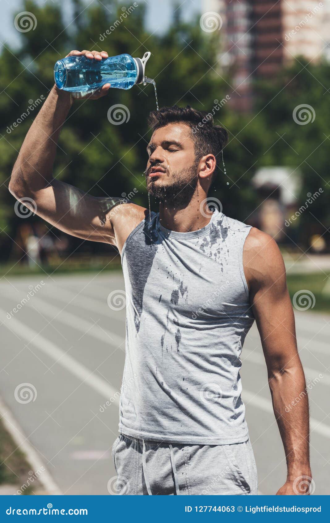 Athletic Young Man Pouring Water on Himself Stock Image - Image of ...
