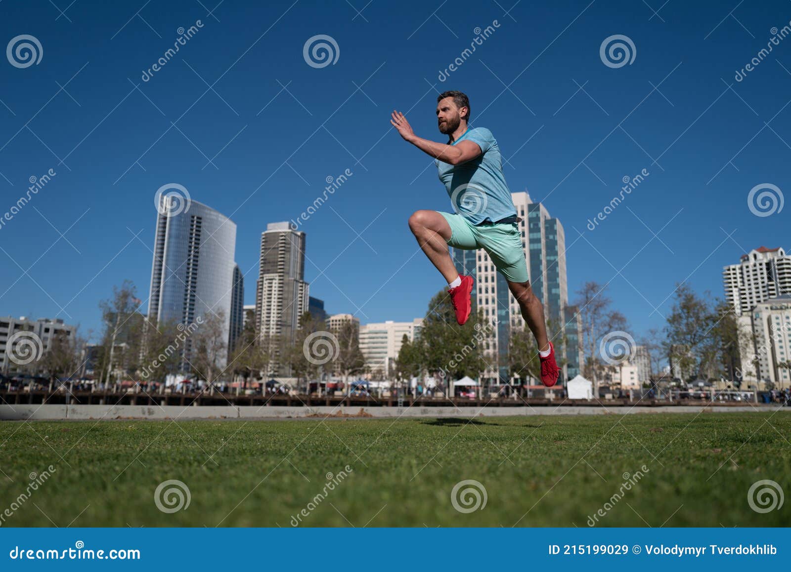 Athletic Young Man Running in the Nature. Dynamic Movement. Stock Image ...