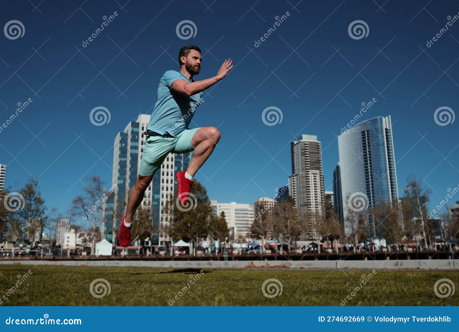 Athletic Young Man Running in the Nature. Dynamic Movement. Stock Image ...