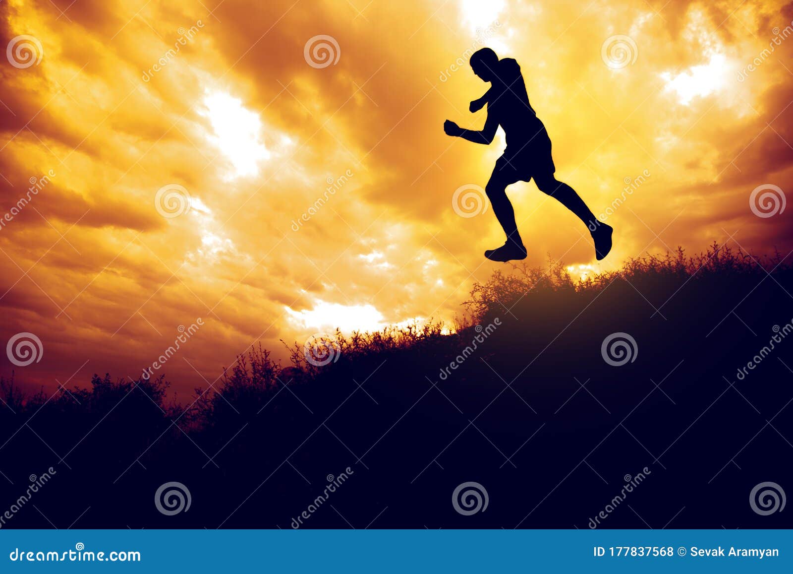 Athletic Young Man is Running in the Nature during Golden Sunset Stock ...