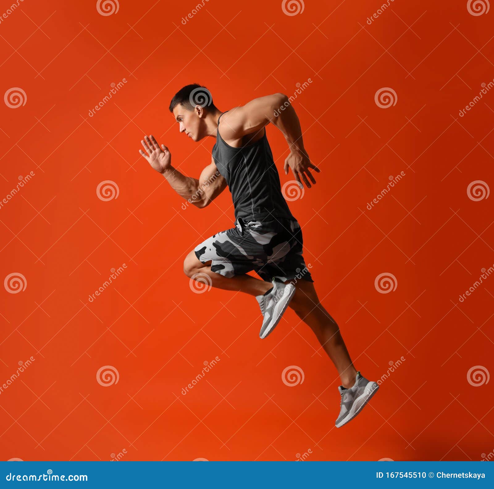 Athletic Young Man Running on Red Background Stock Photo - Image of ...