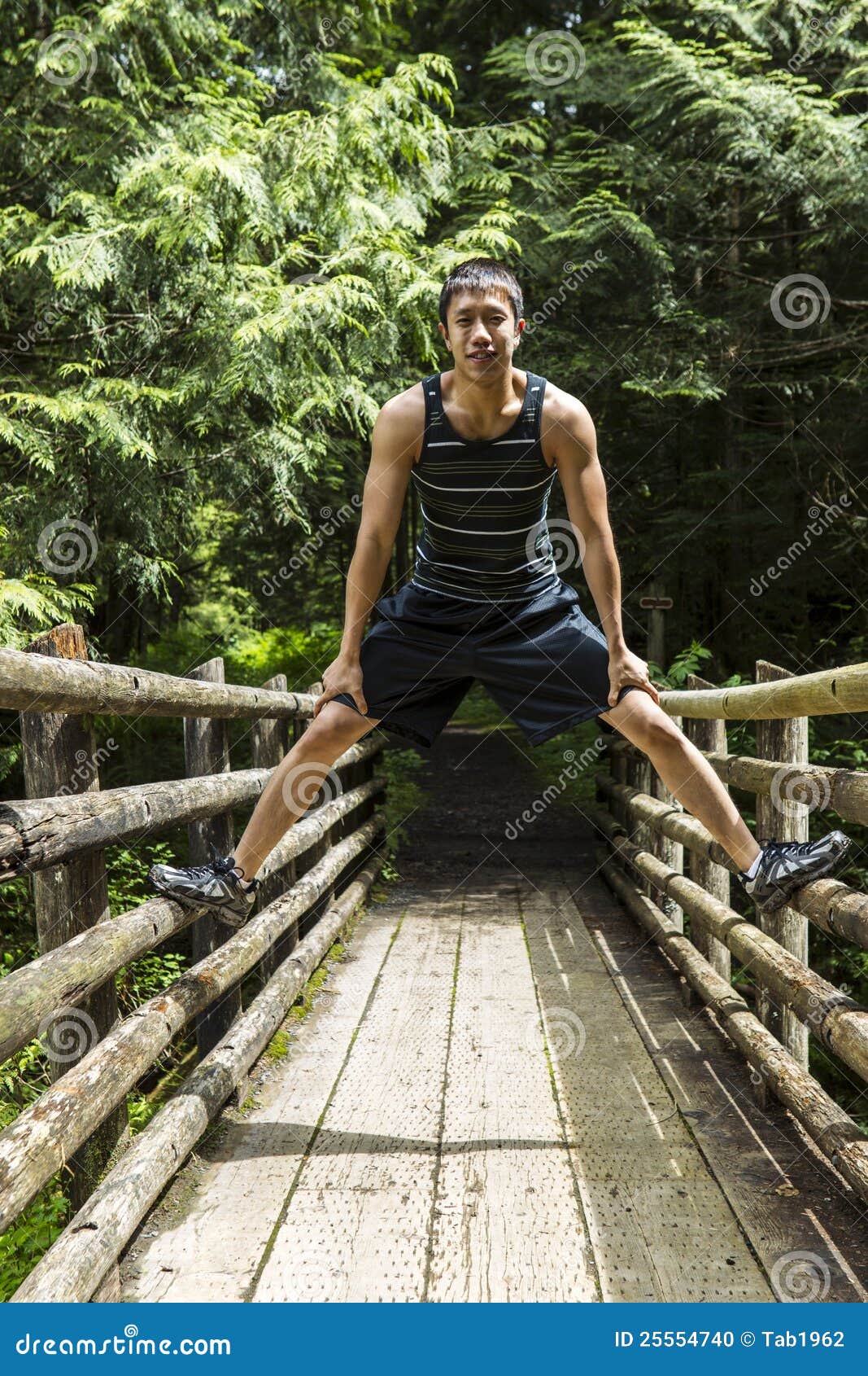 Athletic Young Man on Wooden Bridge Stock Photo - Image of path, people ...