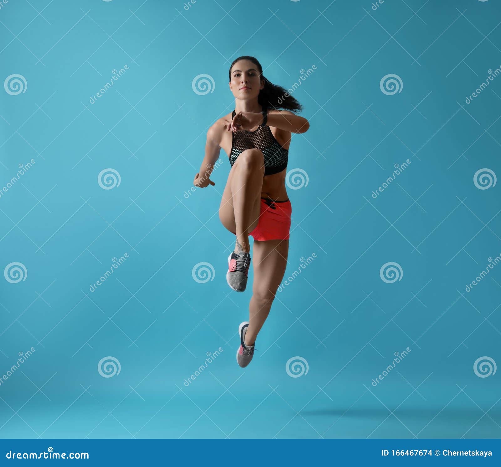 Athletic Young Woman Running on Blue Background Stock Photo - Image of ...