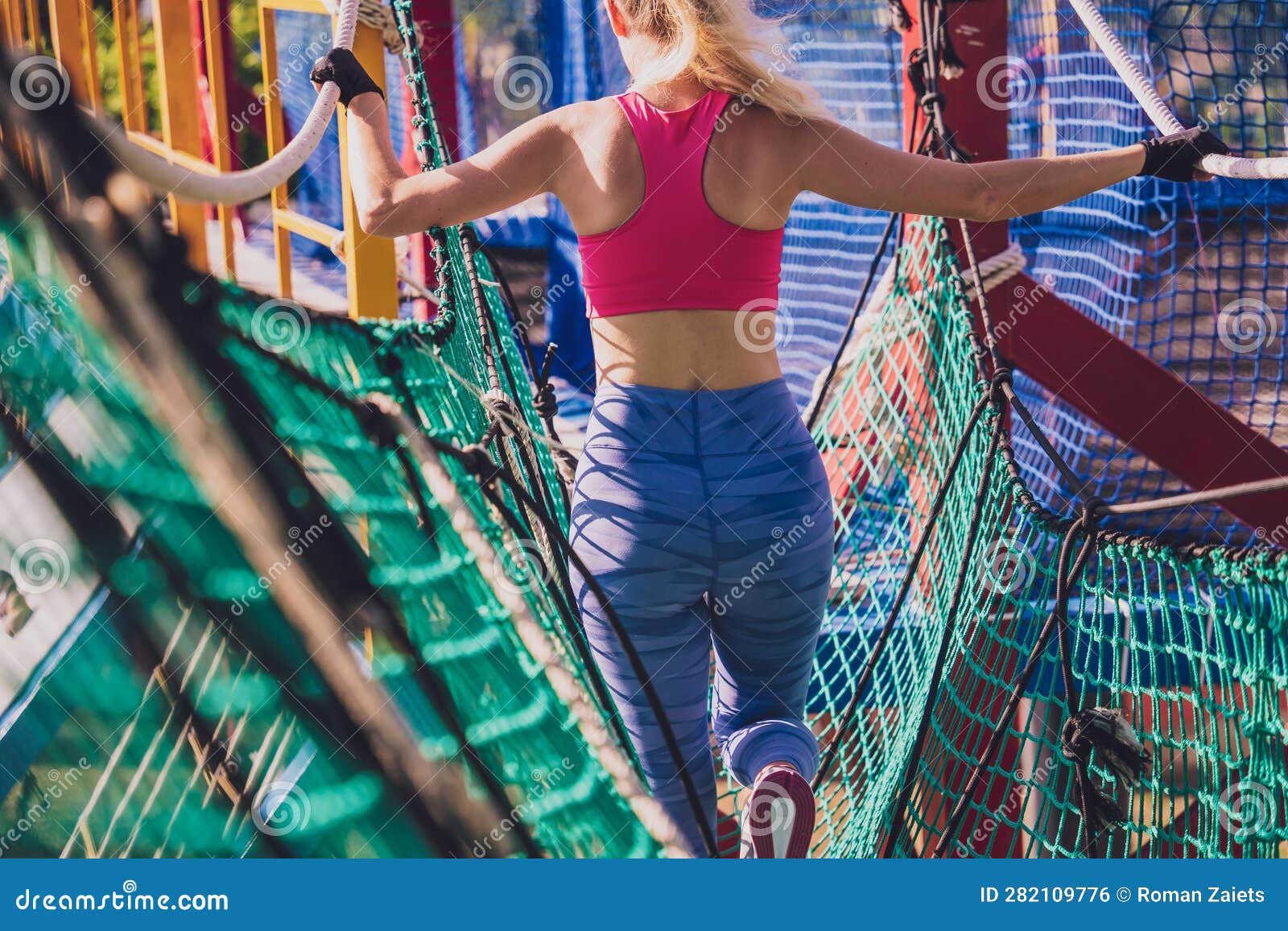 Athletic Young Woman Working Out at the Rope Training Camp. Stock Photo ...
