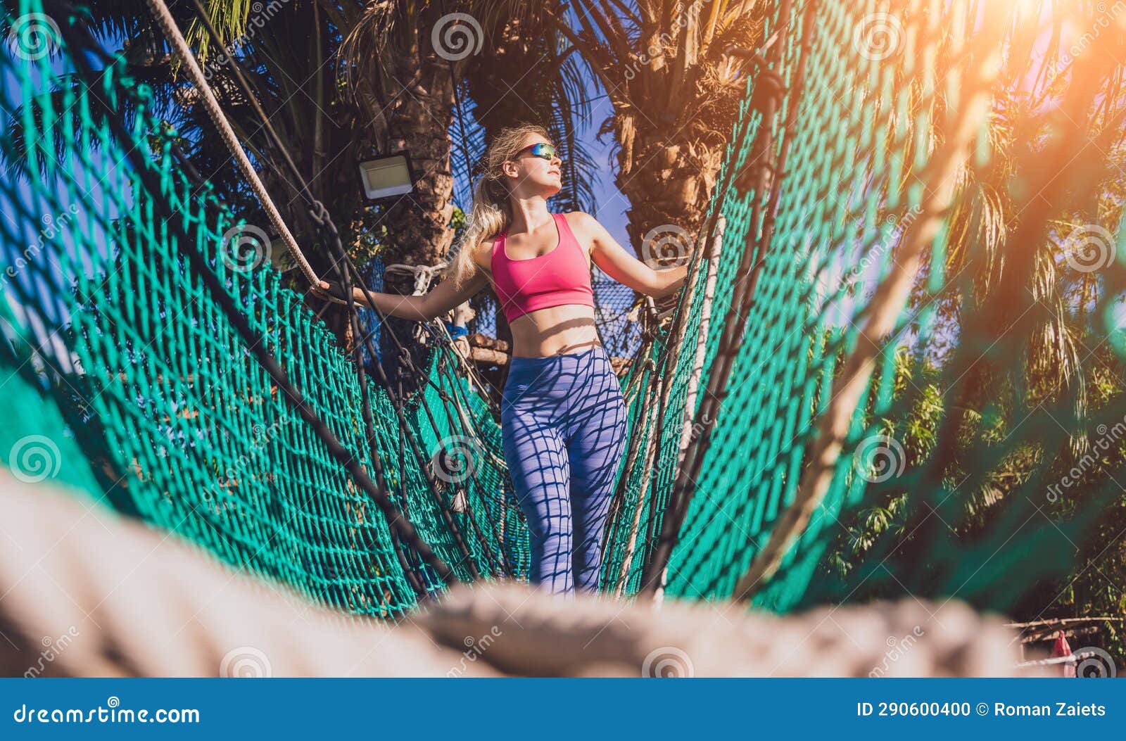 Athletic Young Woman Working Out at the Rope Training Camp. Stock Photo ...