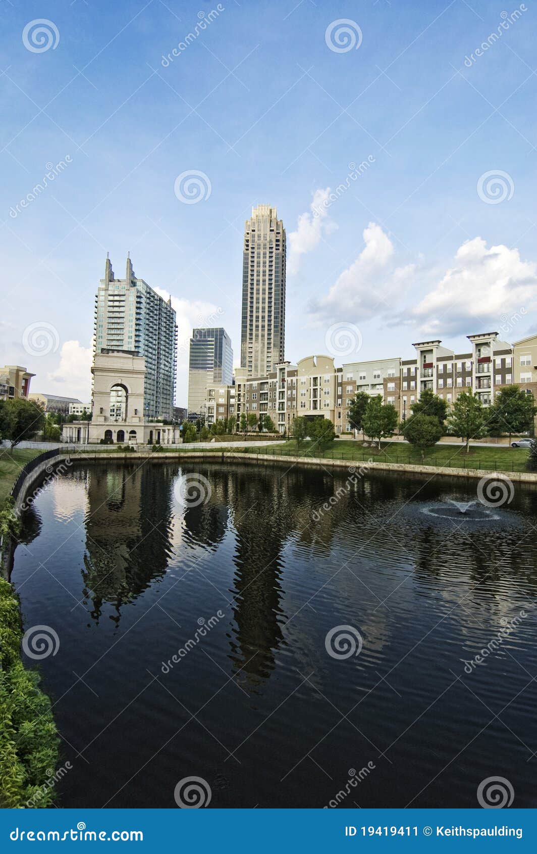 ATL Skyline stock image. Image of condos, pond, park - 19419411