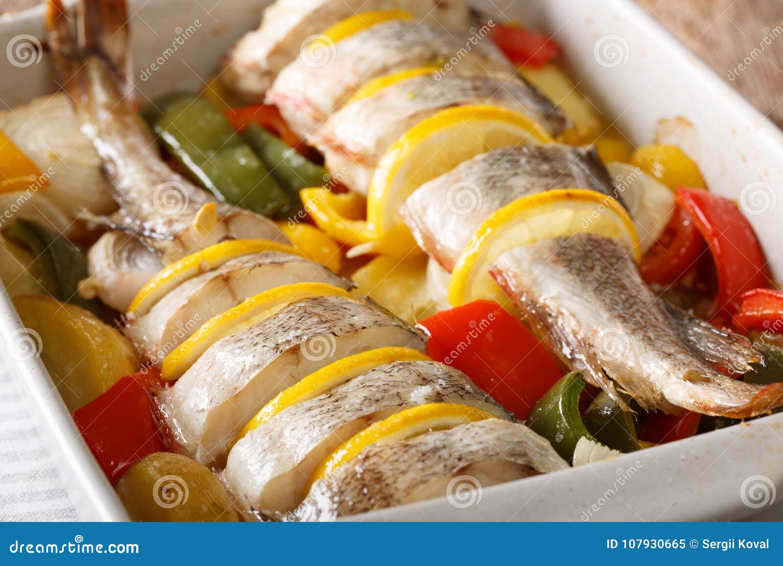 Atlantic Cod Baked with Vegetables in a Baking Dish Close Up. Ho Stock ...