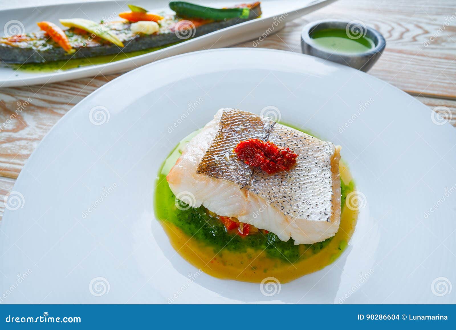 Atlantic Hake Over Dried Tomato Ratatouille Stock Photo - Image of ...