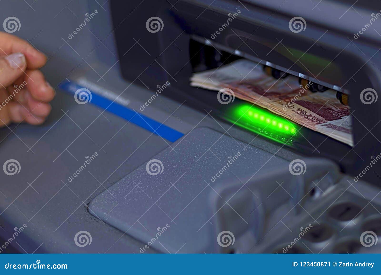 A Bundle of Paper Money is Inserted into the Open ATM Receiver Stock ...