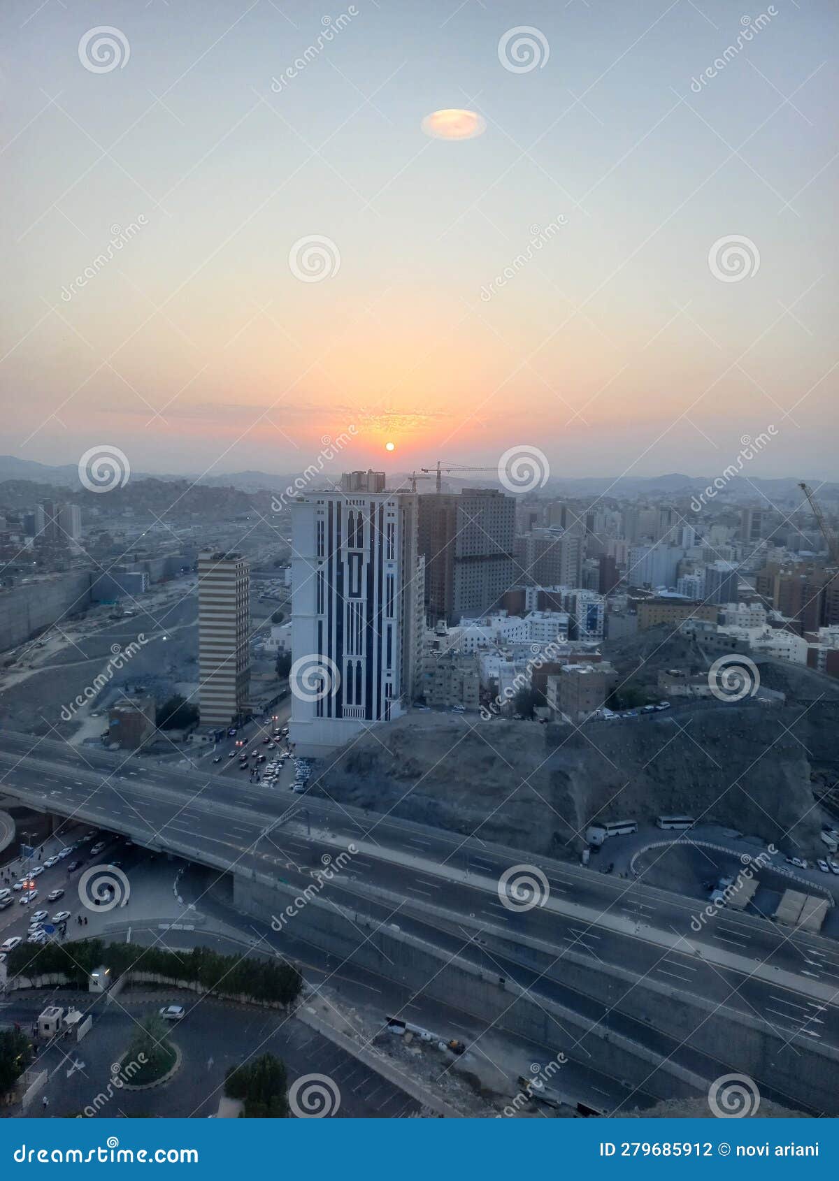 The Atmosphere at Sunset in Downtown Mecca with the Sun Emitting a ...