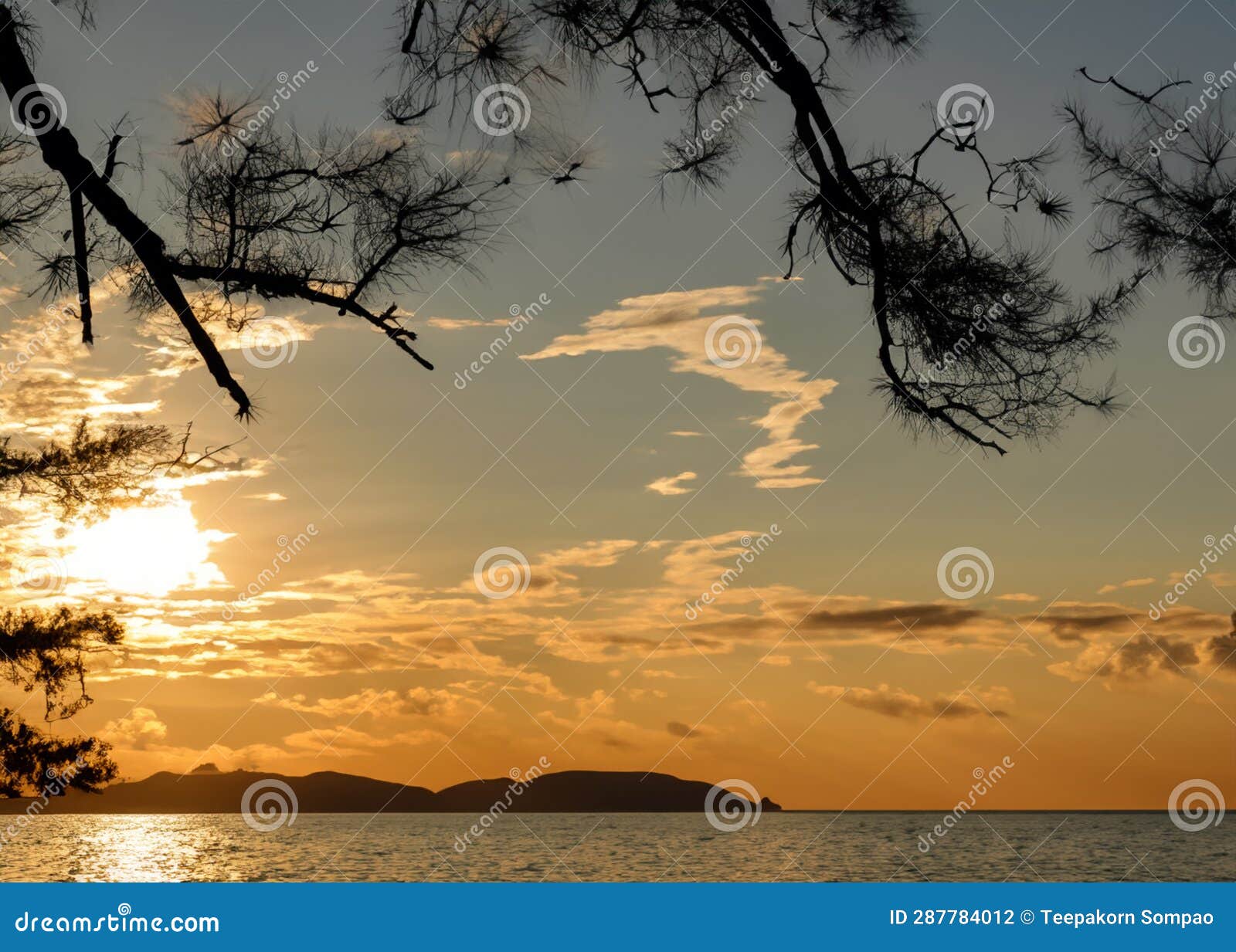 The Atmosphere of Sunset by the Sea Overlooking Mountains Stock Photo ...