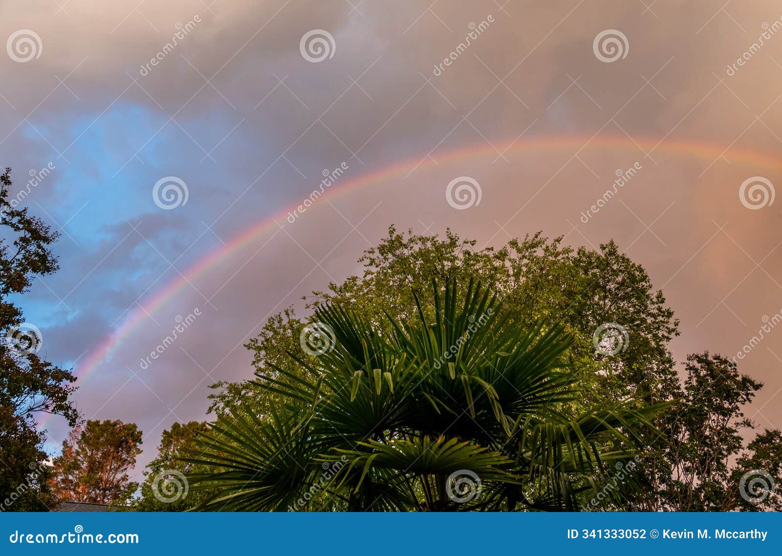 Atmospheric Rainbow Arcing through Broken Clouds Stock Photo - Image of ...