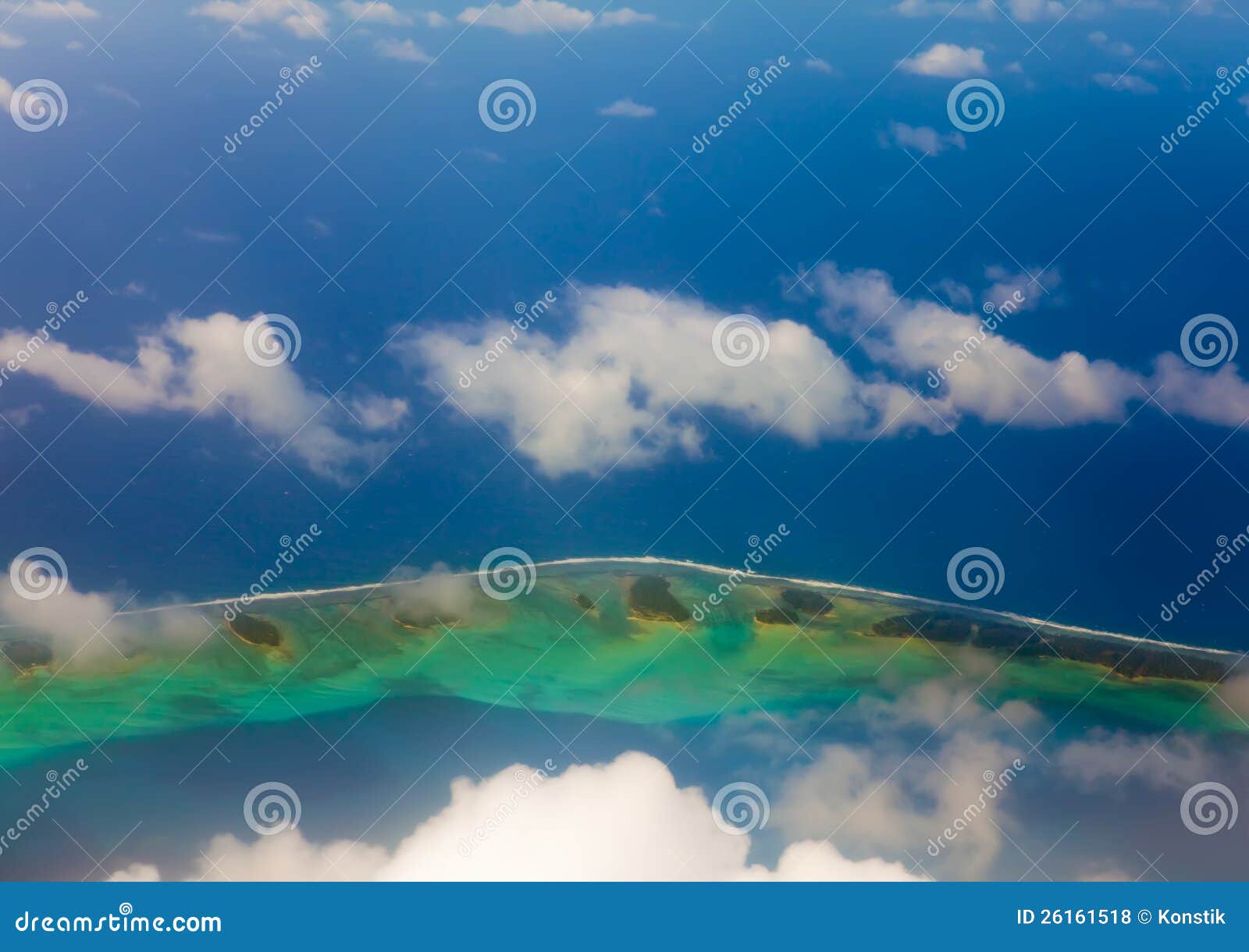 The Atoll Ring at Ocean is Visible through Clouds. Stock Photo - Image ...