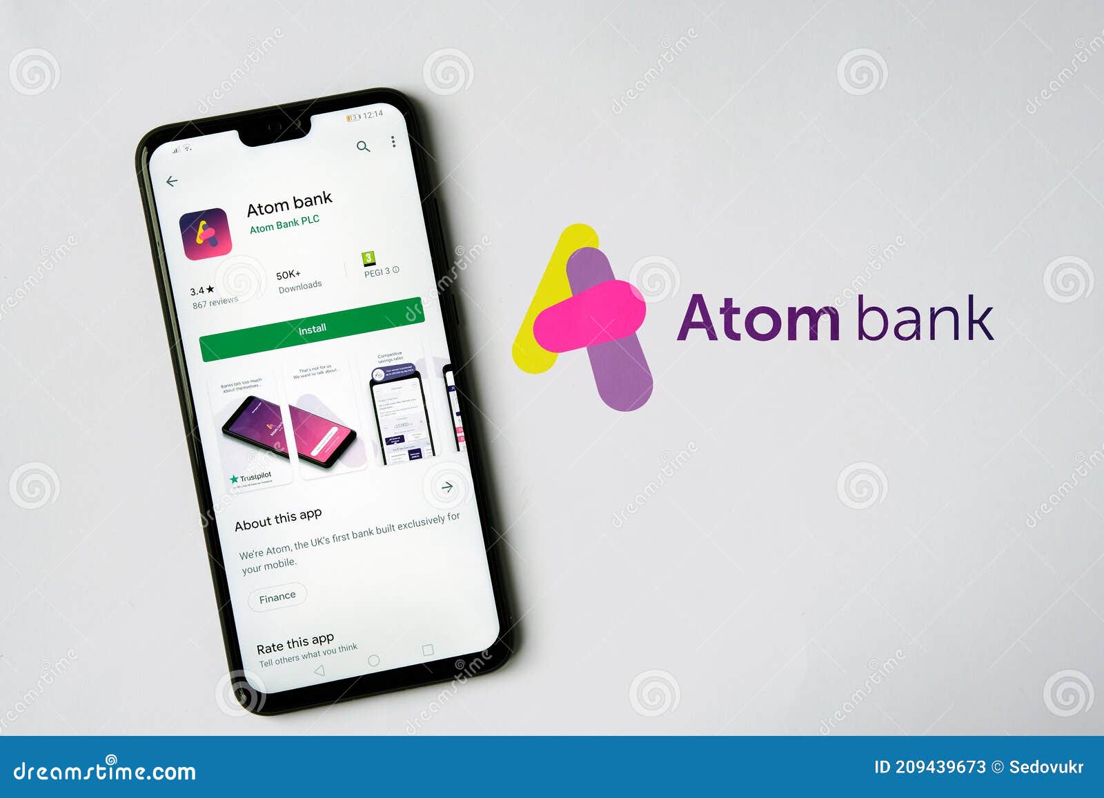 Atom Bank Logo on a Paper and the App on the Smartphone Screen ...