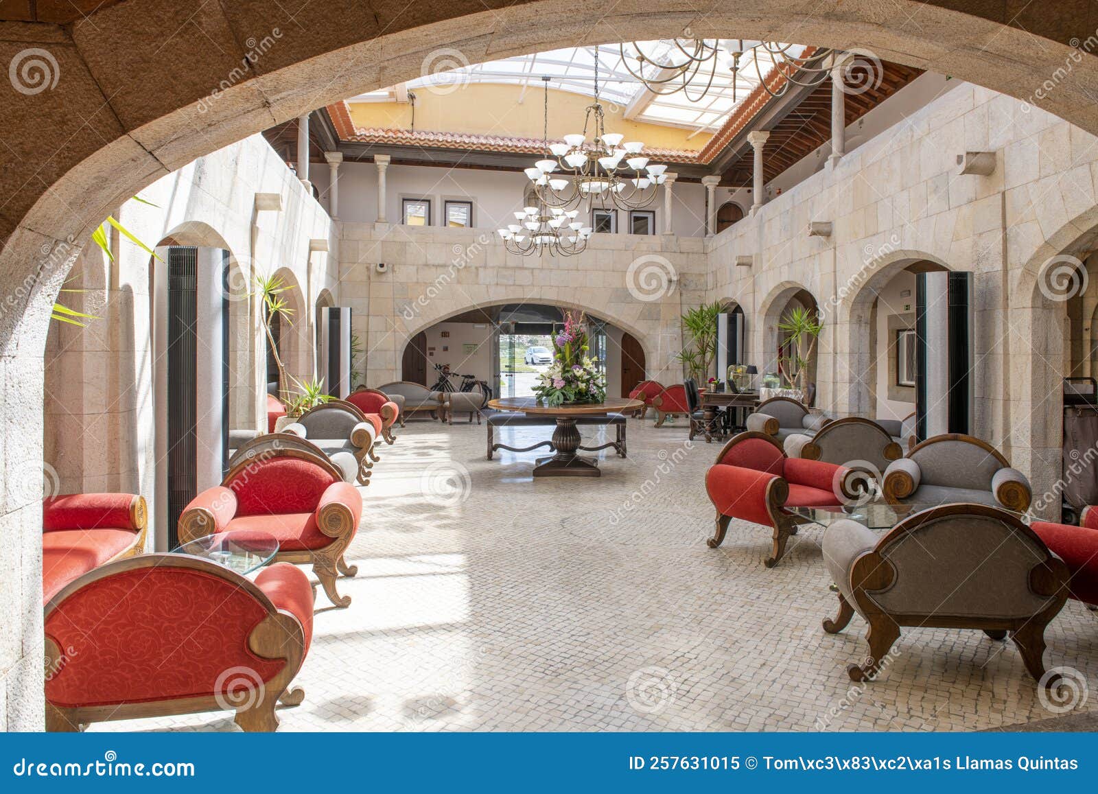 Atrium with Glass Ceilings and White Marble Floors and Stone Walls ...