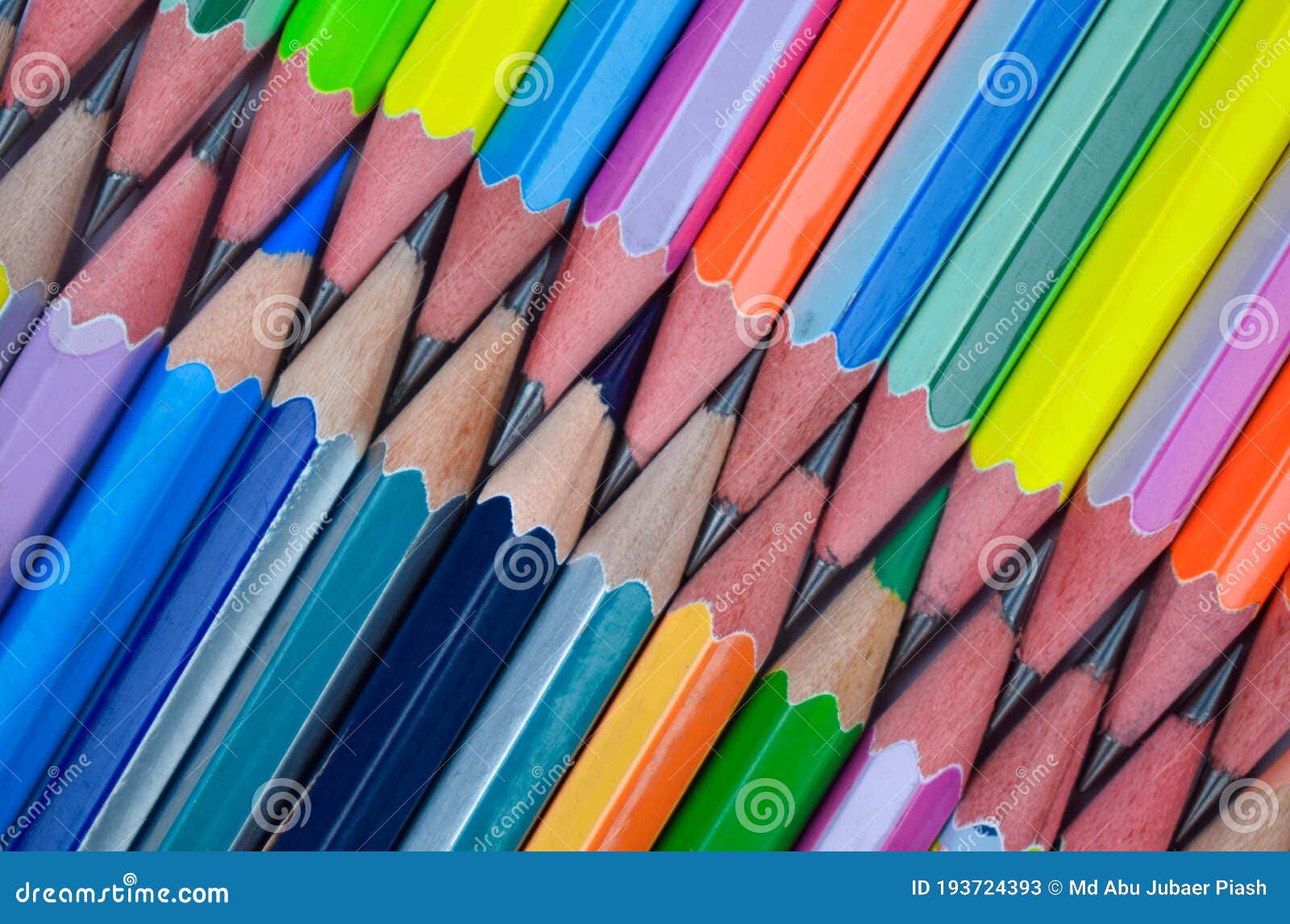 An Attached Row of Many Different Colored Wood Pencil Crayons with ...