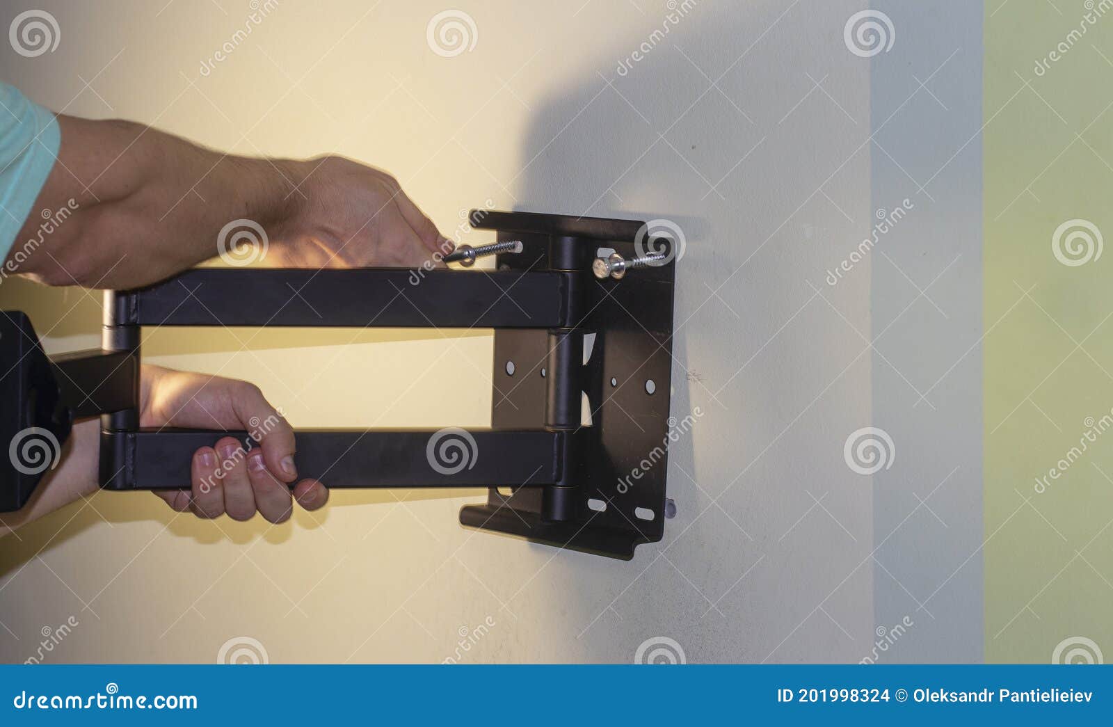 Attaching of the Mount To the Wall Stock Photo - Image of coveralls ...