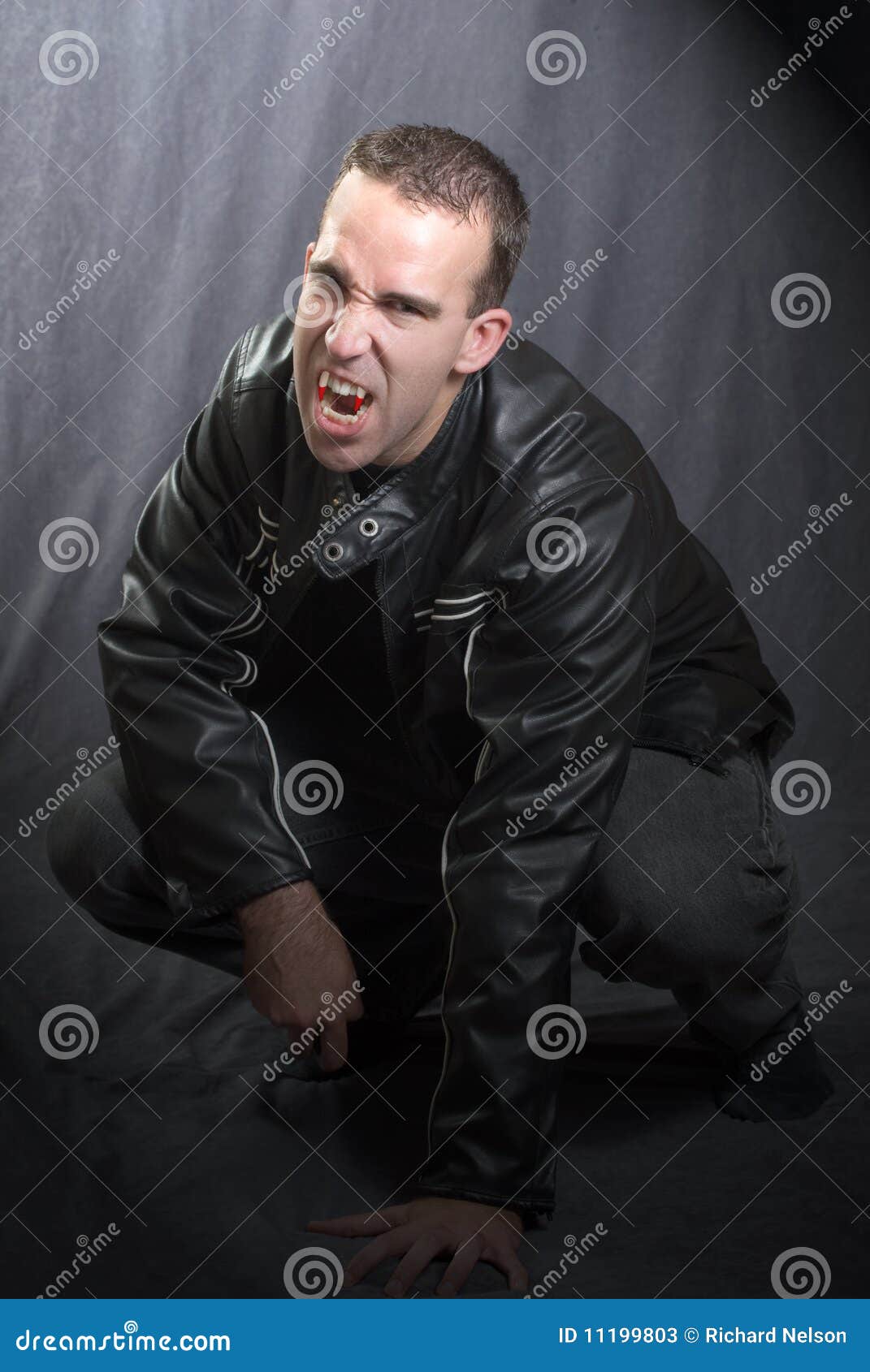 Demon Baring Teeth On Black Background. Royalty-Free Stock Image ...